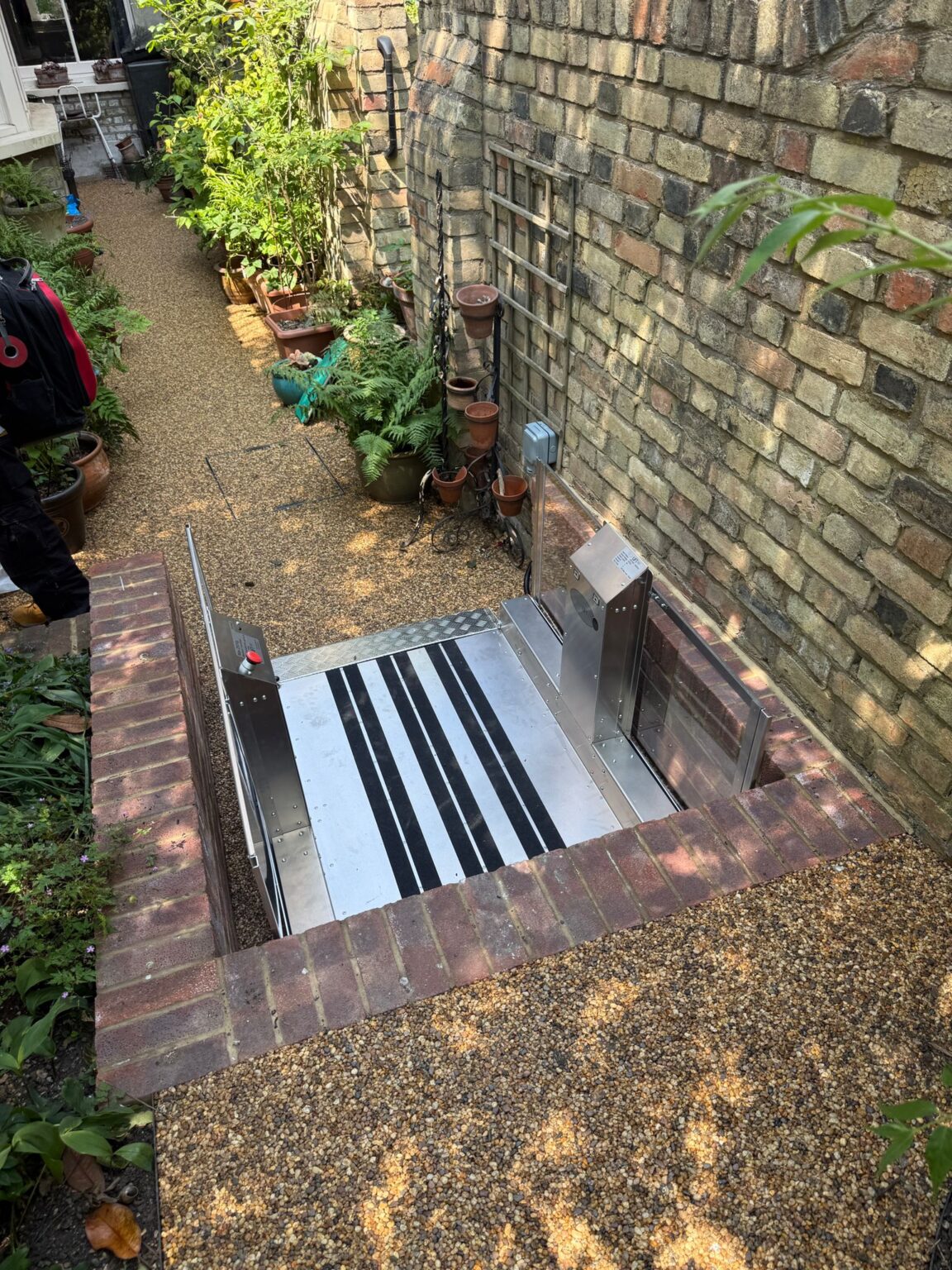 Outdoor platform lift creates garden access at a property in London ...